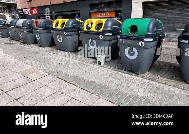 Barcelona, Spain - January 17, 2026: Row of color coded waste and ...