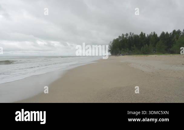 beach sea in cloudy day whilte rain and storm is coming, scary seashore ...