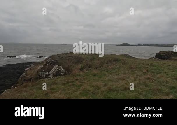 Rugged rocky coastline surrounding Braefoot Bay on Fife coast Scotland ...