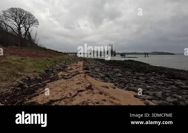 Rugged rocky coastline surrounding Braefoot Bay on Fife coast Scotland ...