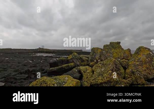 Rugged rocky coastline surrounding Braefoot Bay on Fife coast Scotland ...