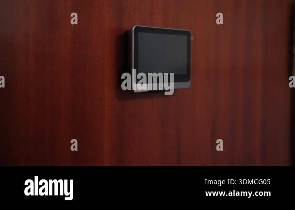 Left side view of front door peephole security camera. Technology and ...