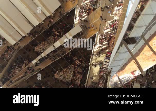 Reflections of a the crowd inside a modern market roof Stock Video ...