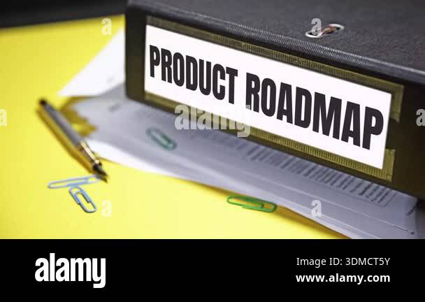 4k animation of a product roadmap binder on a desk with a pen paper ...