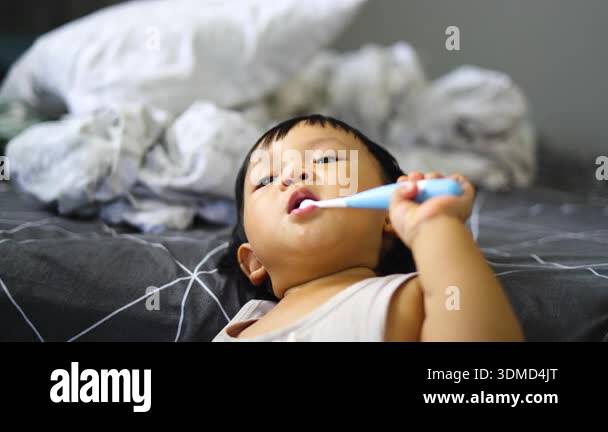 Toddler Brushing Teeth With Focus, A charming film clip of toddler ...