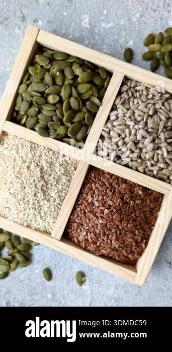 A box of flax, pumpkin, sunflower, and sesame seeds, ingredients for ...