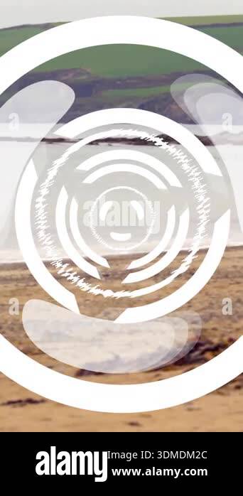 Spinning circular patterns animation over waves crashing on sandy beach ...