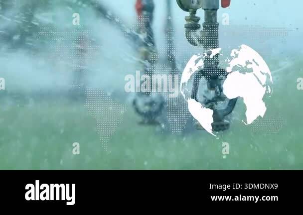 Pressurized water spinning sprinkler spraying mist as world map and ...