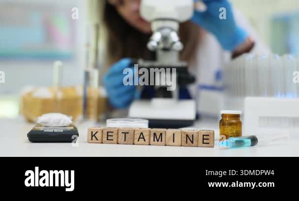 Word Ketamine on wooden cubes medical drugs against female doctor in ...