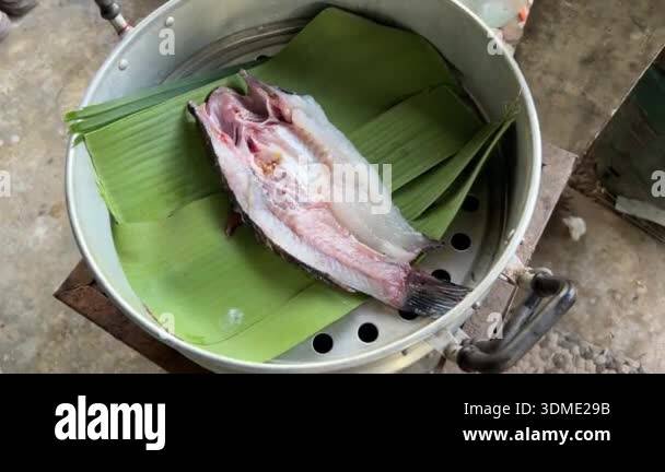 Traditional Thai food video of grilled snakehead fish cooking on a ...
