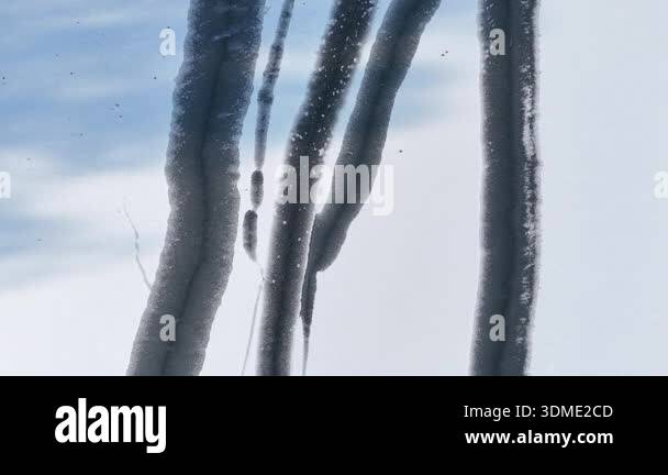 Dark ice formation rises from the frozen surface, with a contrasting ...