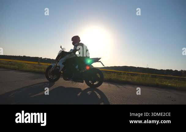 Man riding on a motorbike. Motorcyclist driving his motorcycle on ...
