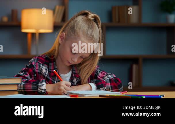 Caucasian girl kid focused busy daughter child drawing with color ...