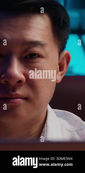 Portrait smiling Asian business man looking at camera working laptop ...