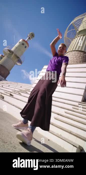 Energetic dancer performing an expressive contemporary freestyle dance ...