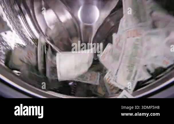 Hundred United States Dollar banknotes inside washing machine - wide ...