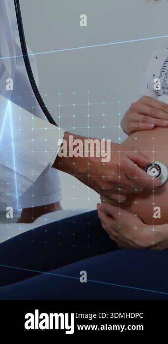 Examining pregnant woman's belly with stethoscope, doctor listening to ...