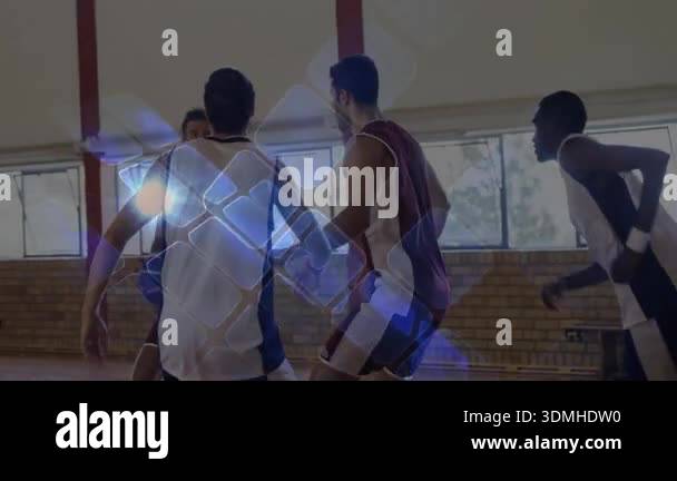 Four basketball players, shooter pivoting shooting, camera panning ball ...