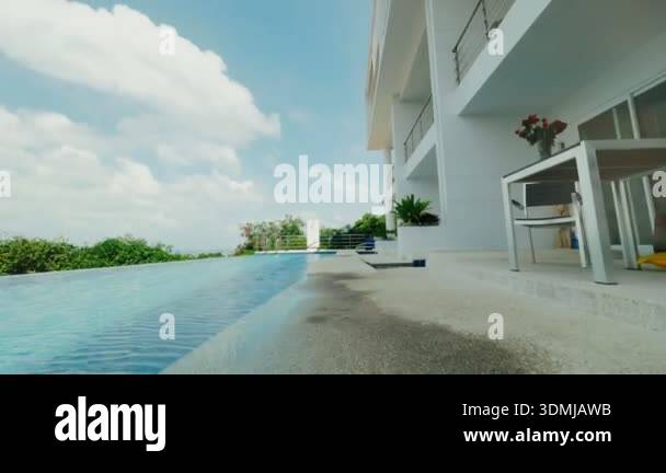 Facade building and balcony with entrance to infinity pool inbusiness ...
