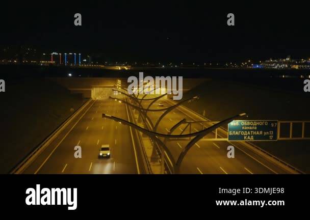 Car traffic on highway and road sign with street names on background ...