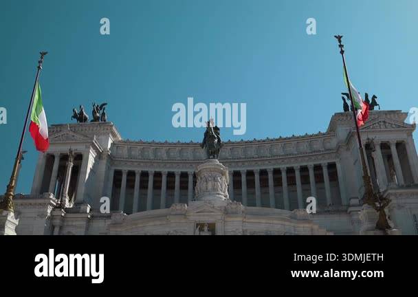 Italian national flags waving above the Vittoriano monument, also known ...