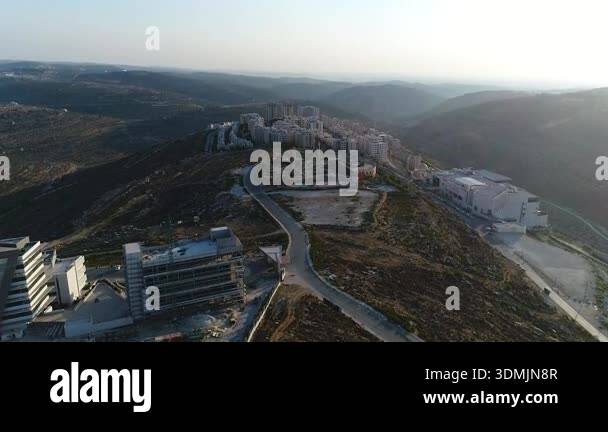 Wide aerial shot showing the construction of Israeli buildings in the ...