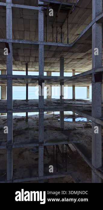 The view reveals the skeletal remains of a concrete building, featuring ...