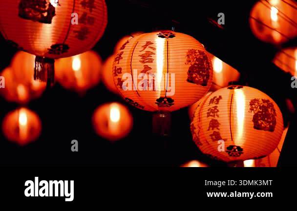 Experience the magic of vibrant Chinese lanterns glowing in the dark ...