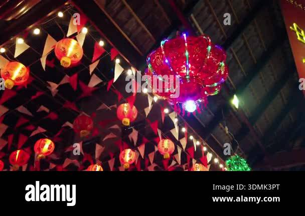 Vibrant Chinese lanterns and decorations create a festive atmosphere ...