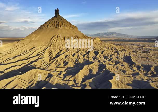 A striking view of Factory Butte in Utah, showcasing its dramatic ...