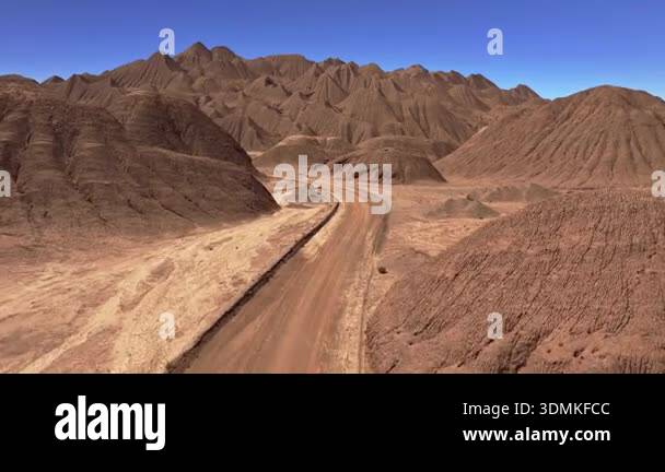 A remote desert road winds through the high altitude landscape of La ...
