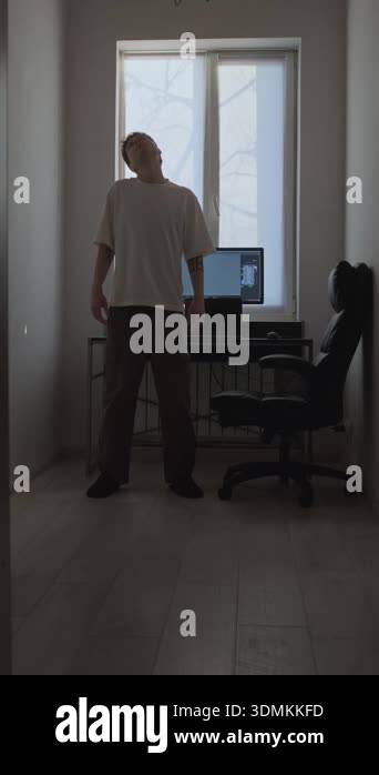 Freelancer stretching in home office during work break, remote work ...