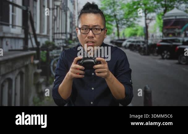 Young chinese man gripping game Stock Videos & Footage - HD and 4K ...