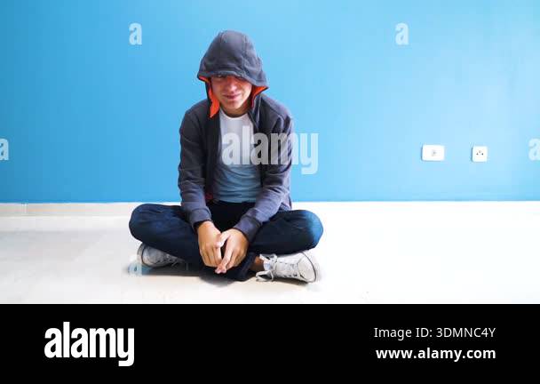 international autism awareness day- young man sitting with his back to ...