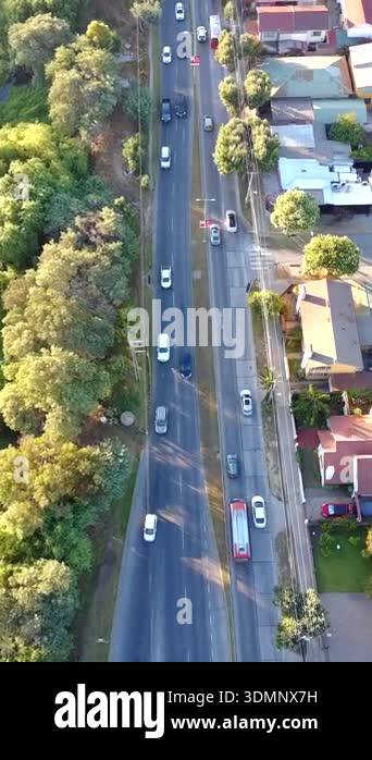 Cinematic 4K aerial drone footage of a coastal road running alongside ...