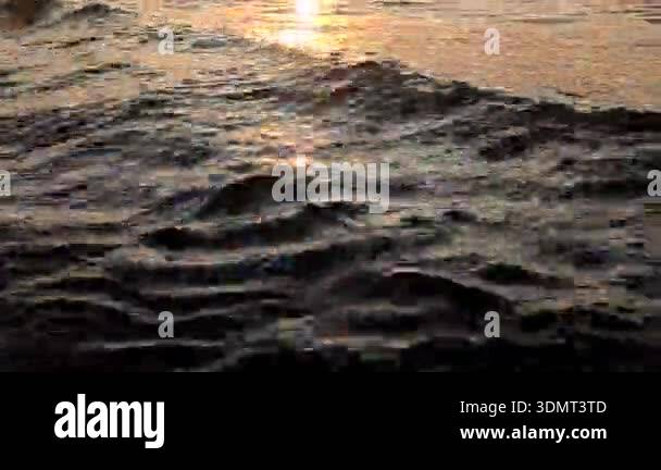 The surface of the sea waves with a sun path in the morning at sunrise ...