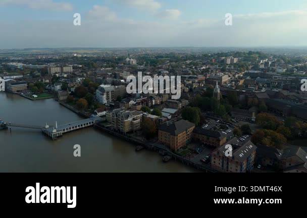 Moody aerial view of Gravesend town across the River Thames during a ...