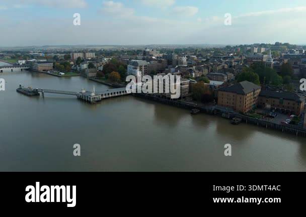 Moody aerial view of Gravesend town across the River Thames during a ...