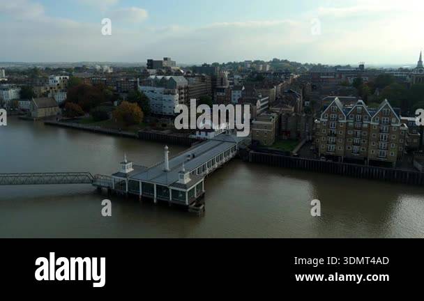 Moody aerial view of Gravesend town across the River Thames during a ...
