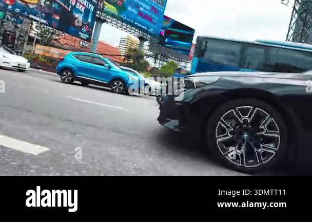 Motorcycle overtaking cars in Bangkok city traffic dynamic ride ...