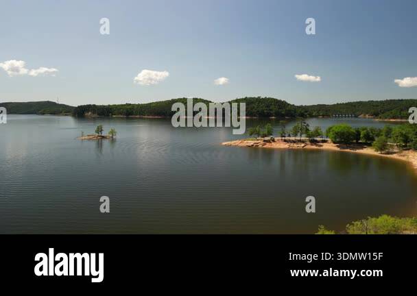 Drone video of lake reflections with calm water and summer natural ...