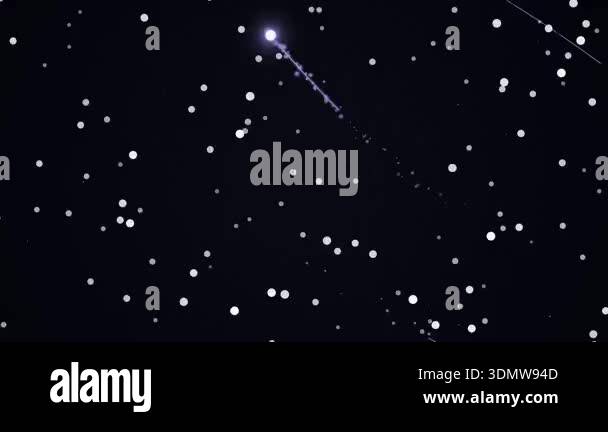 Shooting star or meteor flashing through the night sky, leaving a ...