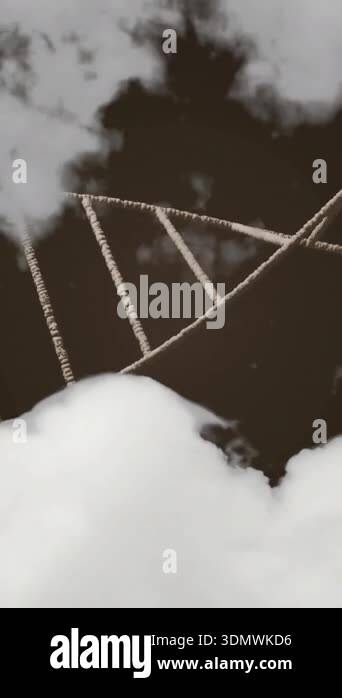 Animation of DNA strand floating over clouds in dark sky, creating ...
