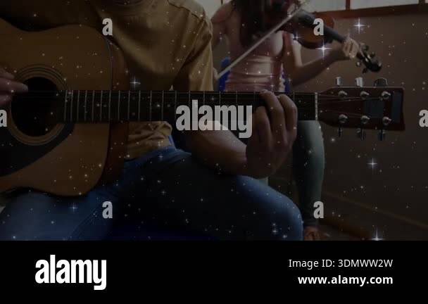 Fretting chord and strumming causing camera pullback revealing ...