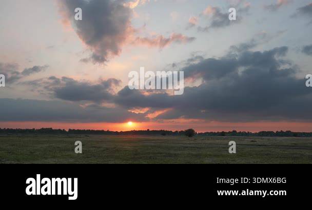 Scenic Sunset Cloudy Sky over Field. 4K 10-bit Stock Video Footage - Alamy
