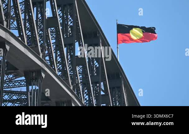 SYDNEY - JAN 07 2026:Australian Aboriginal flag on Sydney Harbour ...