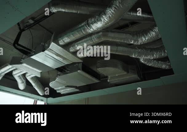 Complex industrial HVAC system featuring metal air ducts and ...
