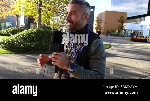 Smiling male journalist holding microphone Stock Videos & Footage - HD ...