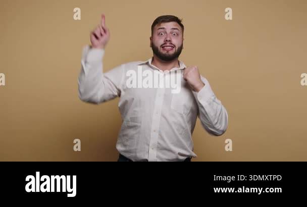 man expresses excitement with hand movements and facial expressions ...