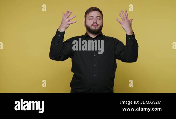 Person uses sign language to communicate on a bright yellow background ...